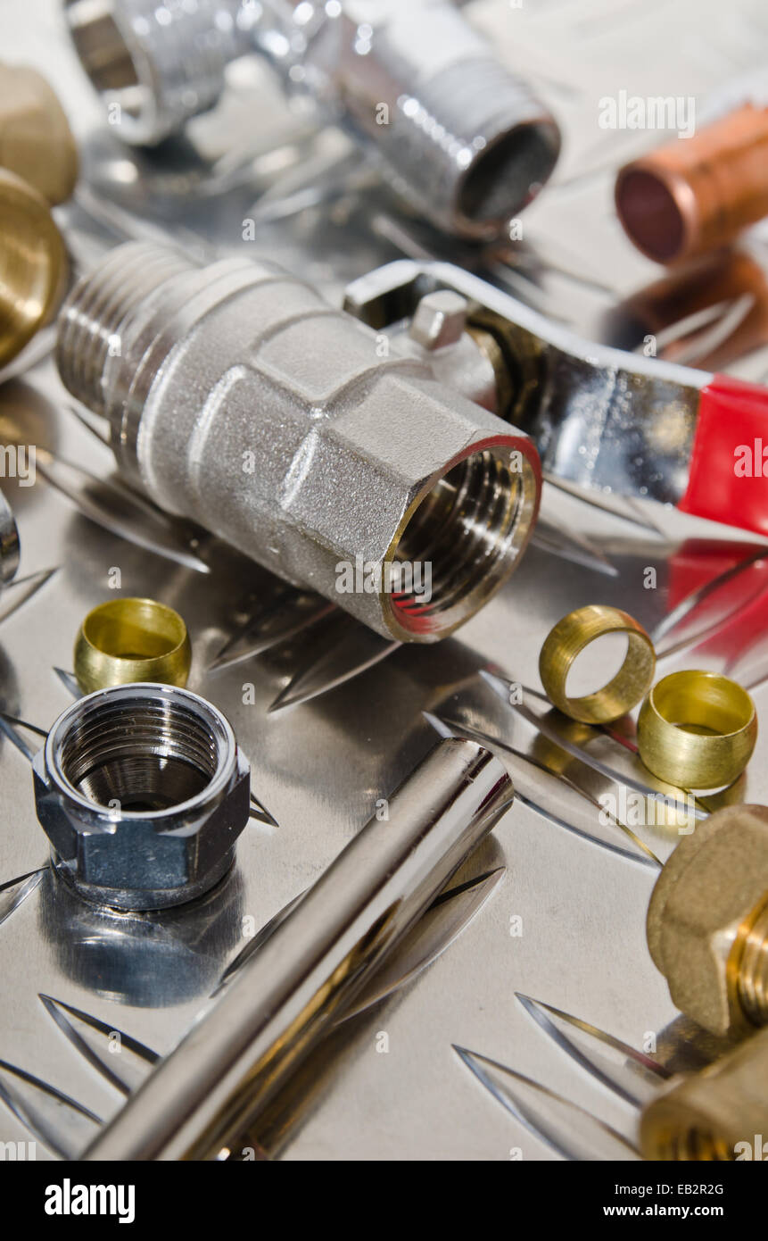 Plumbing inlet pipe valve on a metal surface Stock Photo - Alamy