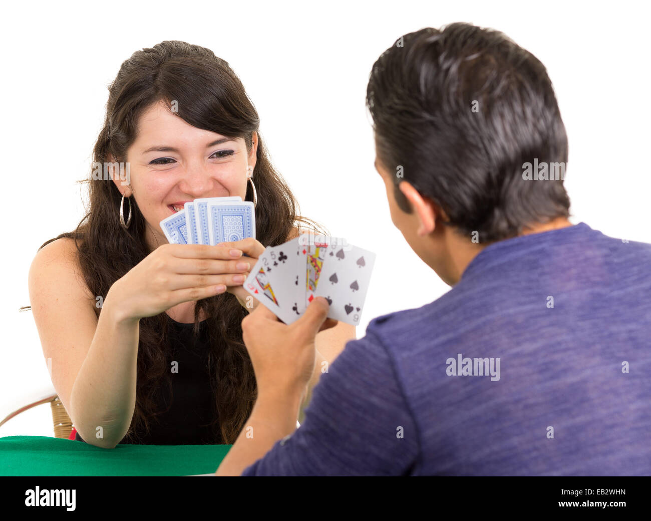 young couple playing cards cuarenta Stock Photo - Alamy