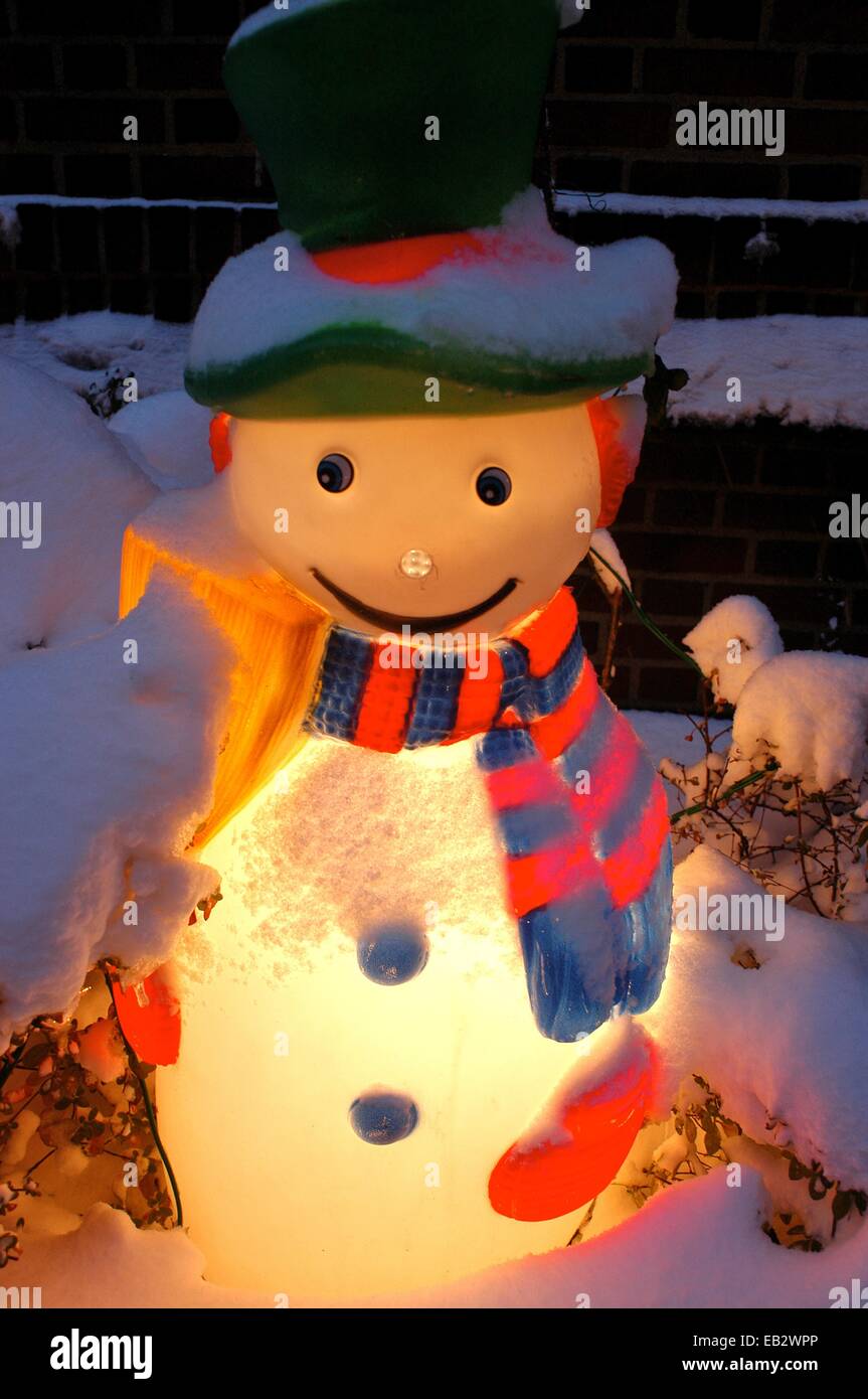 A snowman with an inner glow during a blizzard in New York City Stock ...