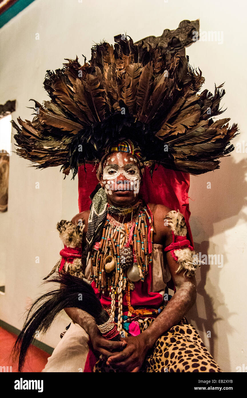 A Spirit dancer decorated in facial paint, shells, beads and a ...