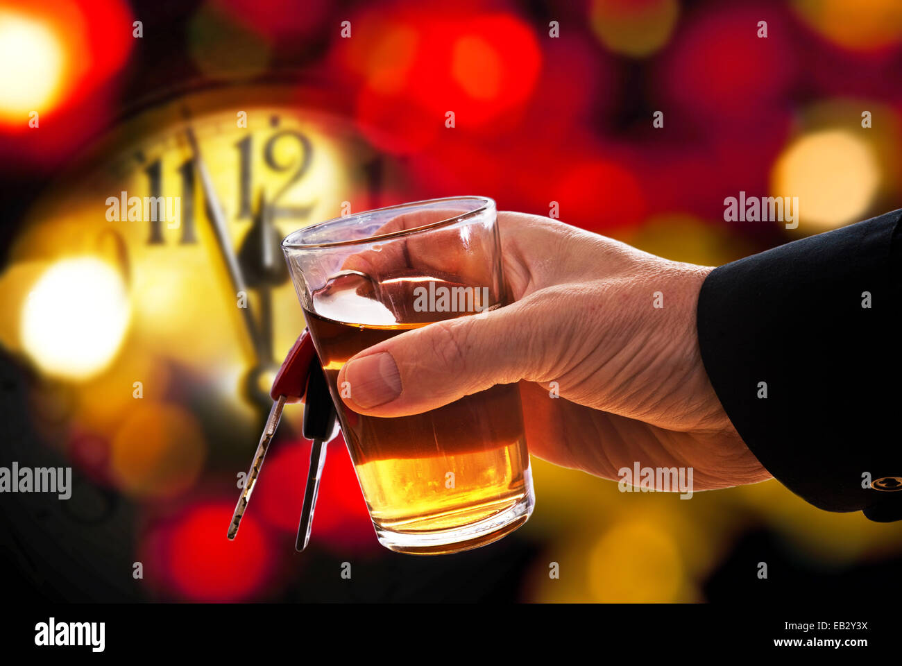 face of new year clock with a alcohol glass Stock Photo - Alamy