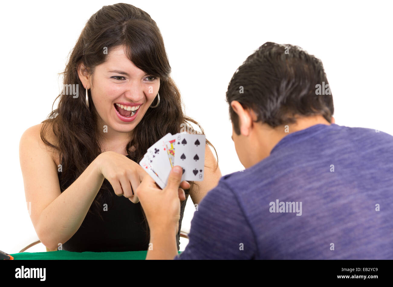 young couple playing cards cuarenta Stock Photo - Alamy