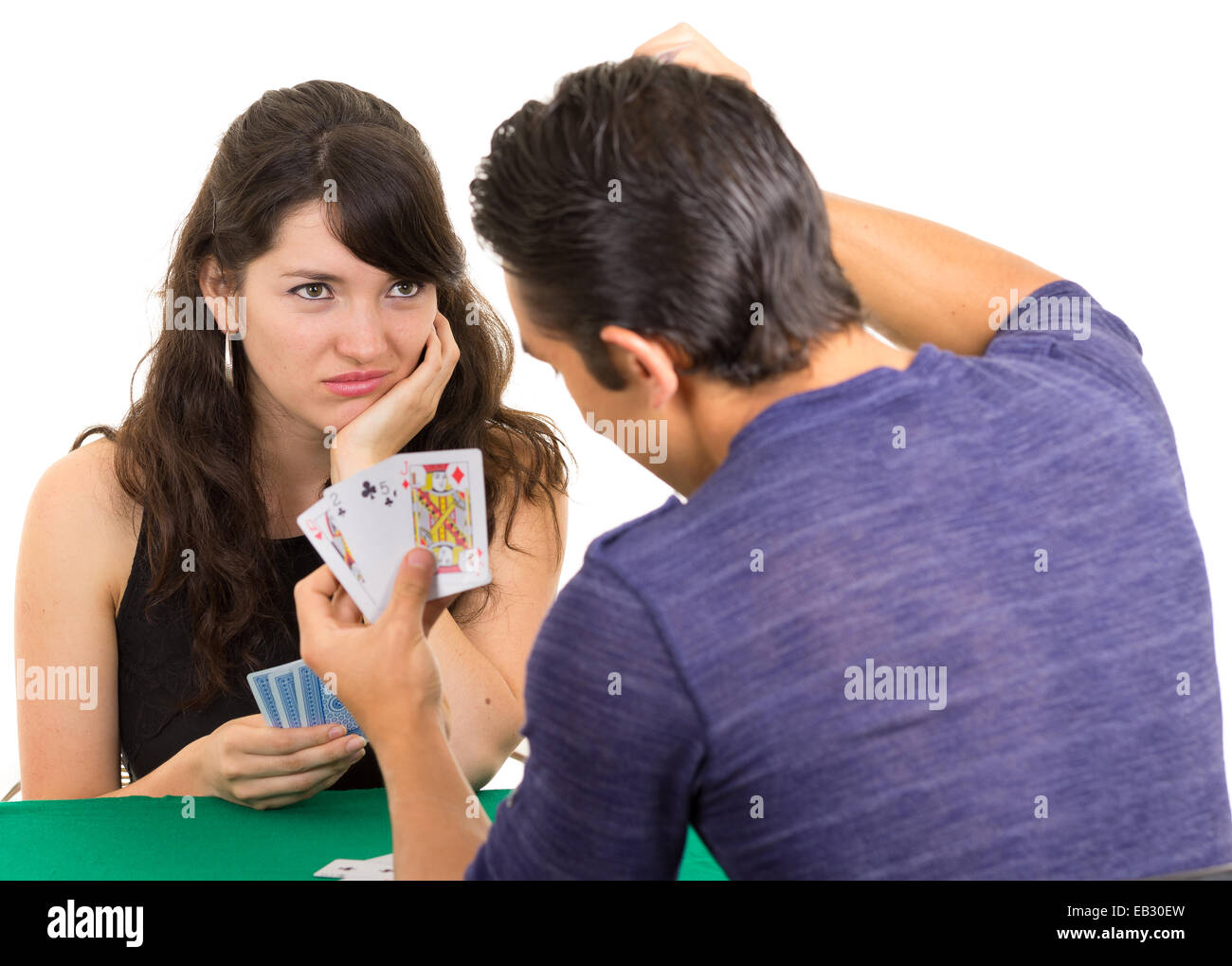 young couple playing cards cuarenta Stock Photo - Alamy