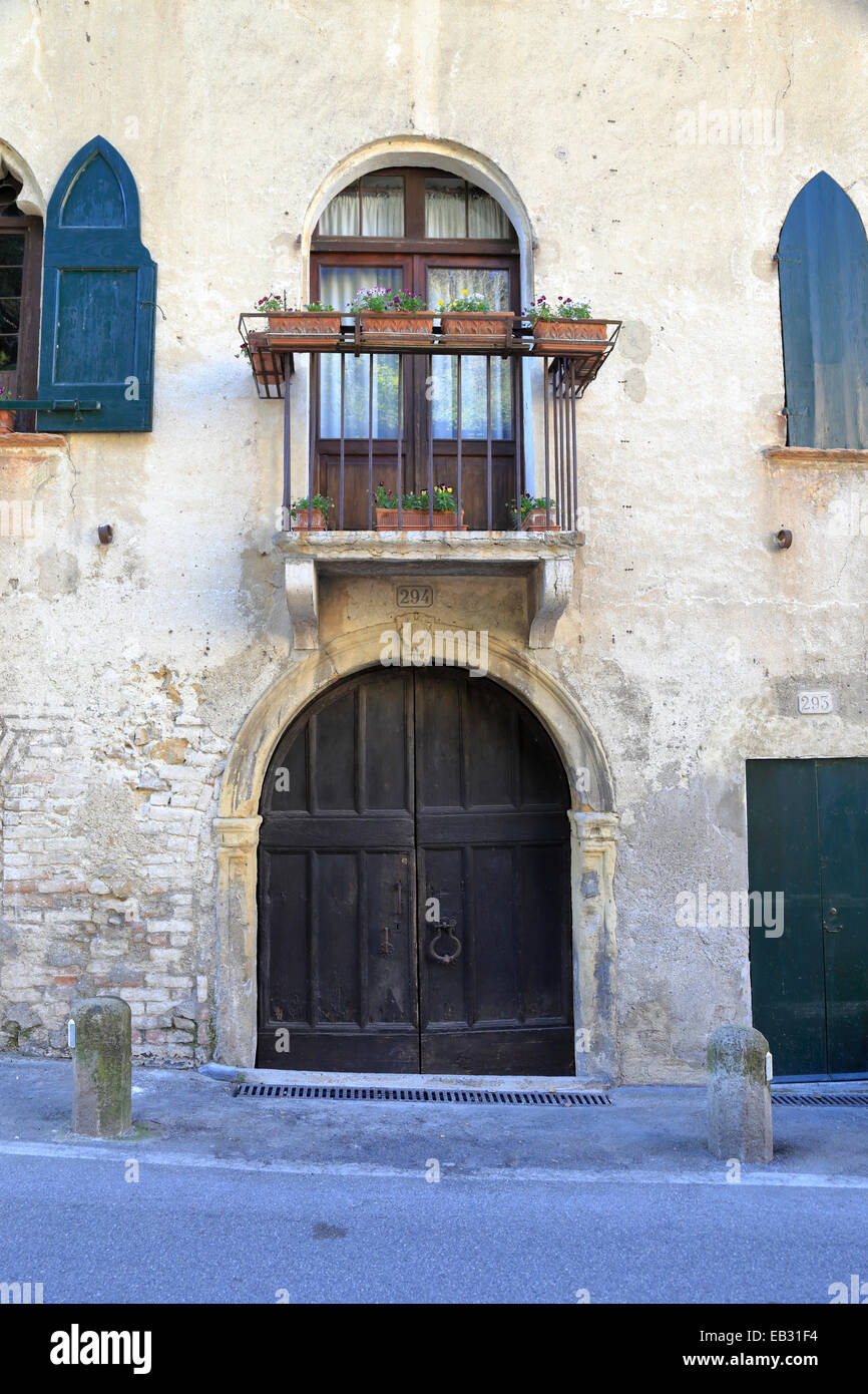 Old arched wooden door and window in Asolo, Italy, Veneto Stock Photo ...