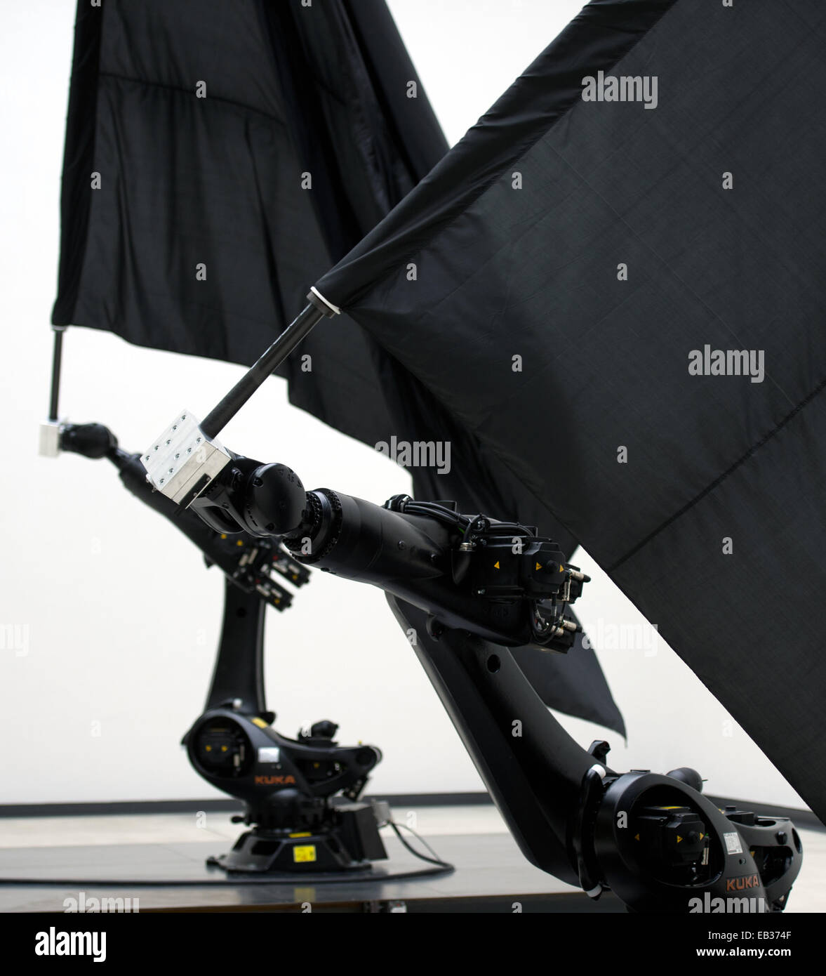 Dresden, Germany. 25th Nov, 2014. Two industrial robots wave giant ...