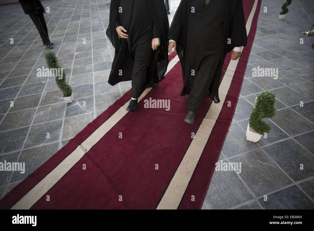 Qom, Iran. 24th Nov, 2014. November 24, 2014 - Qom, Iran - Two clerics ...