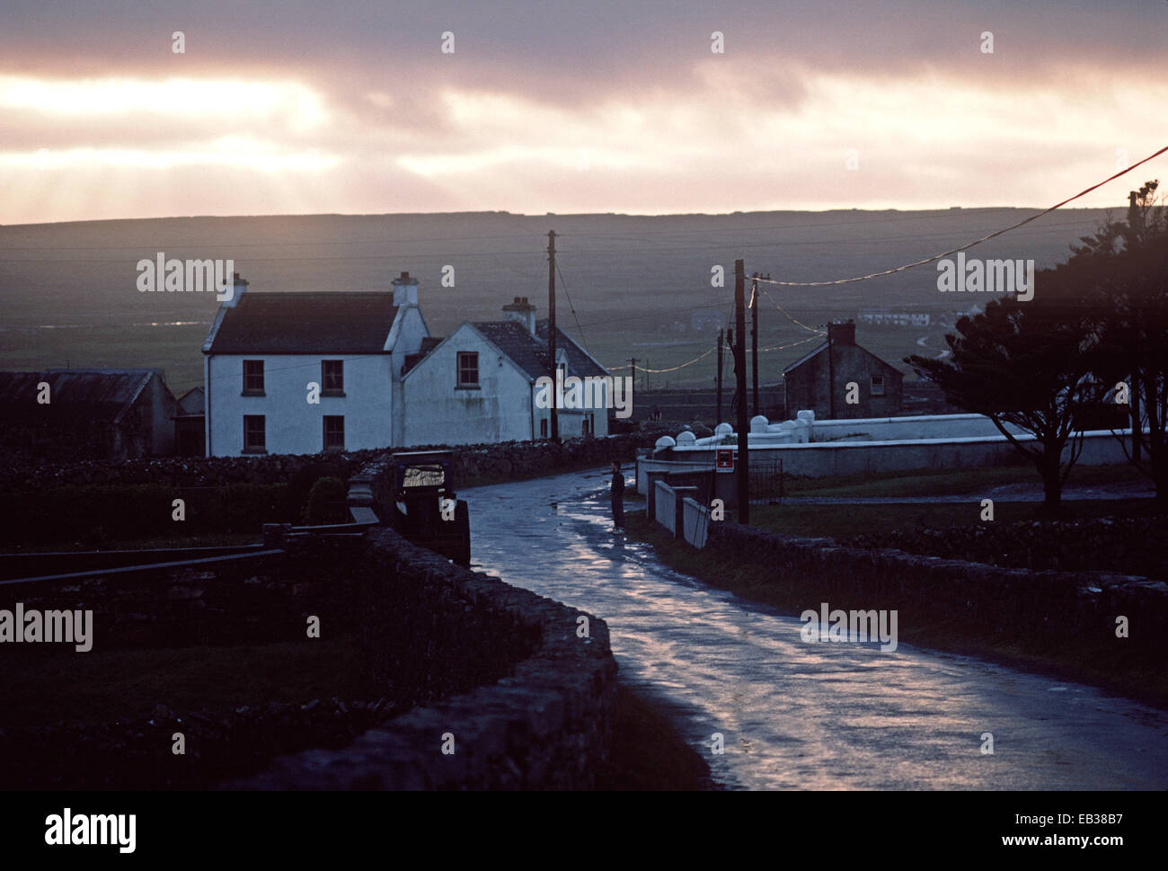 HOUSES AND ROAD IN EVENING LIGHT, INISHMORE, ARAN ISLANDS, IRELAND ...