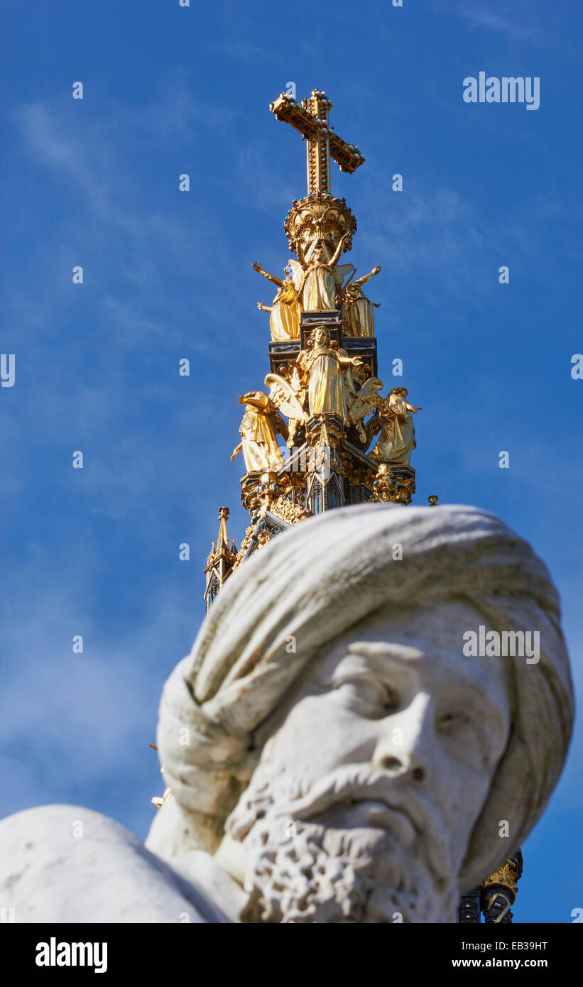 Gilded golden angels and ornate cross on top of Albert Memorial by ...