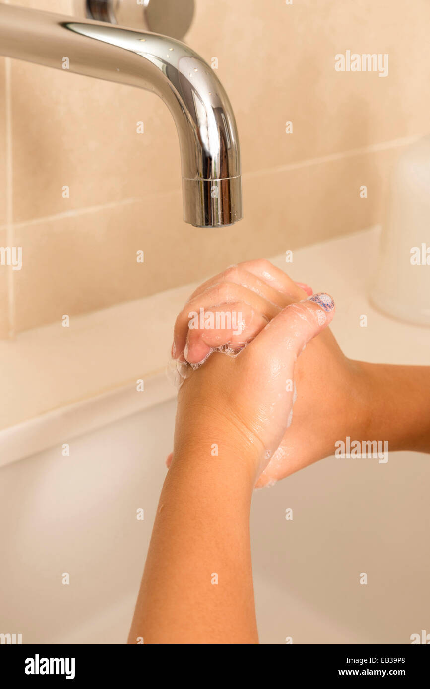 Closeup of child washing hands under the tap Stock Photo - Alamy