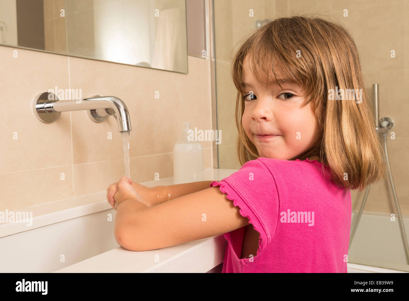 Closeup of child washing hands under the tap Stock Photo - Alamy