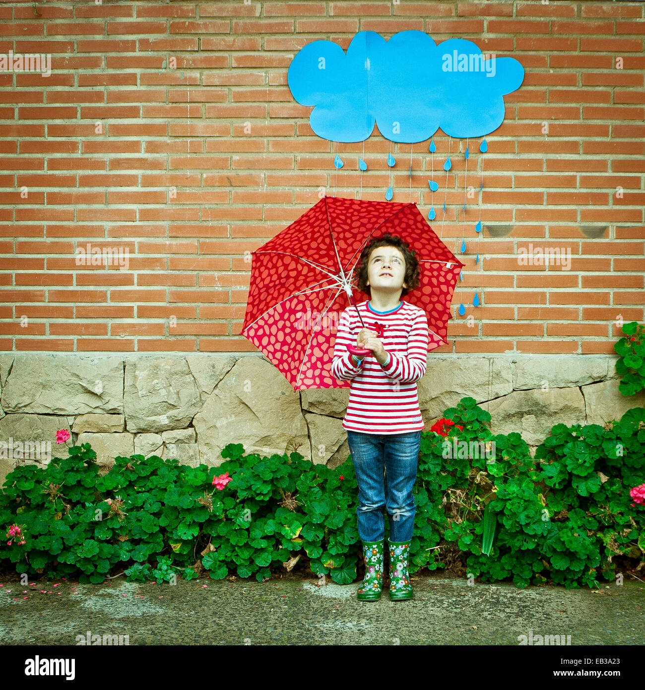 Girl standing under cloud rain hi-res stock photography and images - Alamy