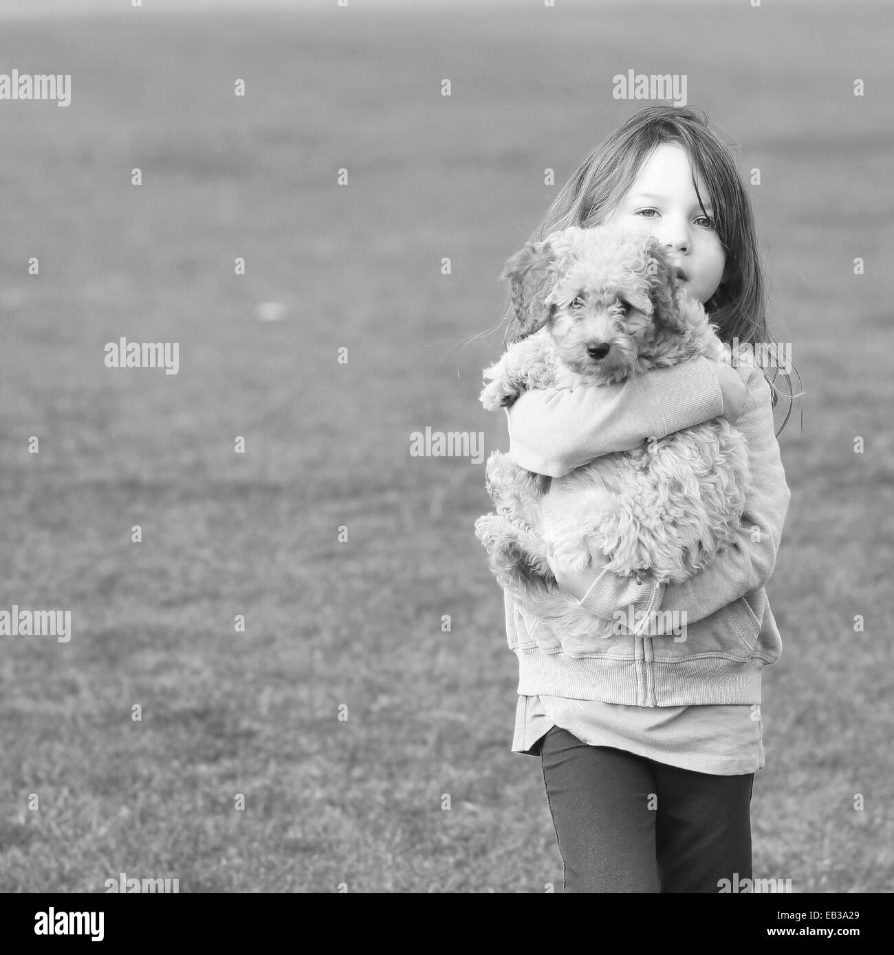 Child puppy hugging hi-res stock photography and images - Alamy