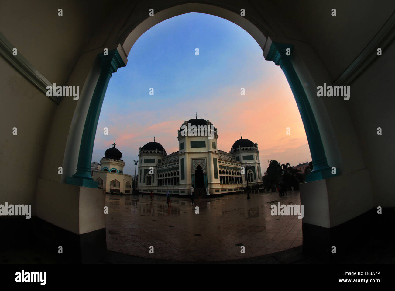 View of mosque in town square from arch way Stock Photo - Alamy