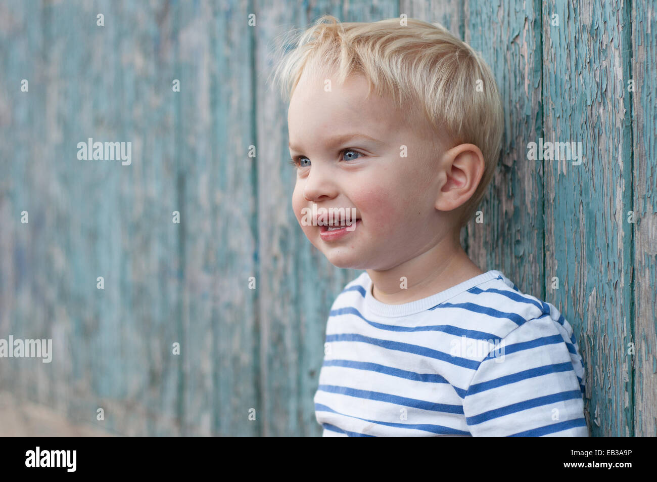 Portrait of boy leaning against wooden wall Stock Photo - Alamy Portrait of boy leaning against wooden wall Stock Photo - Alamy