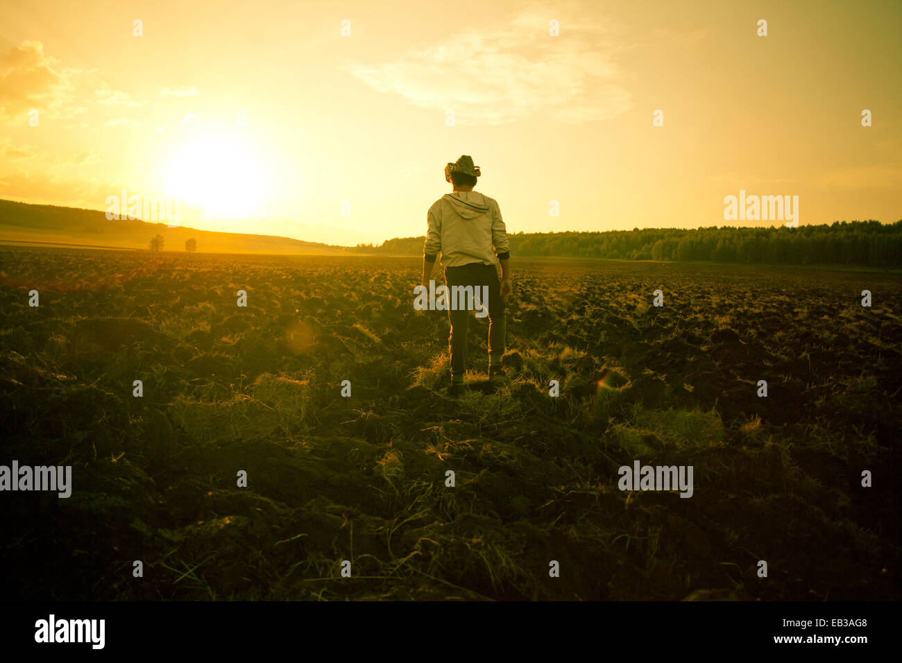 Mari man standing in rural field Stock Photo - Alamy