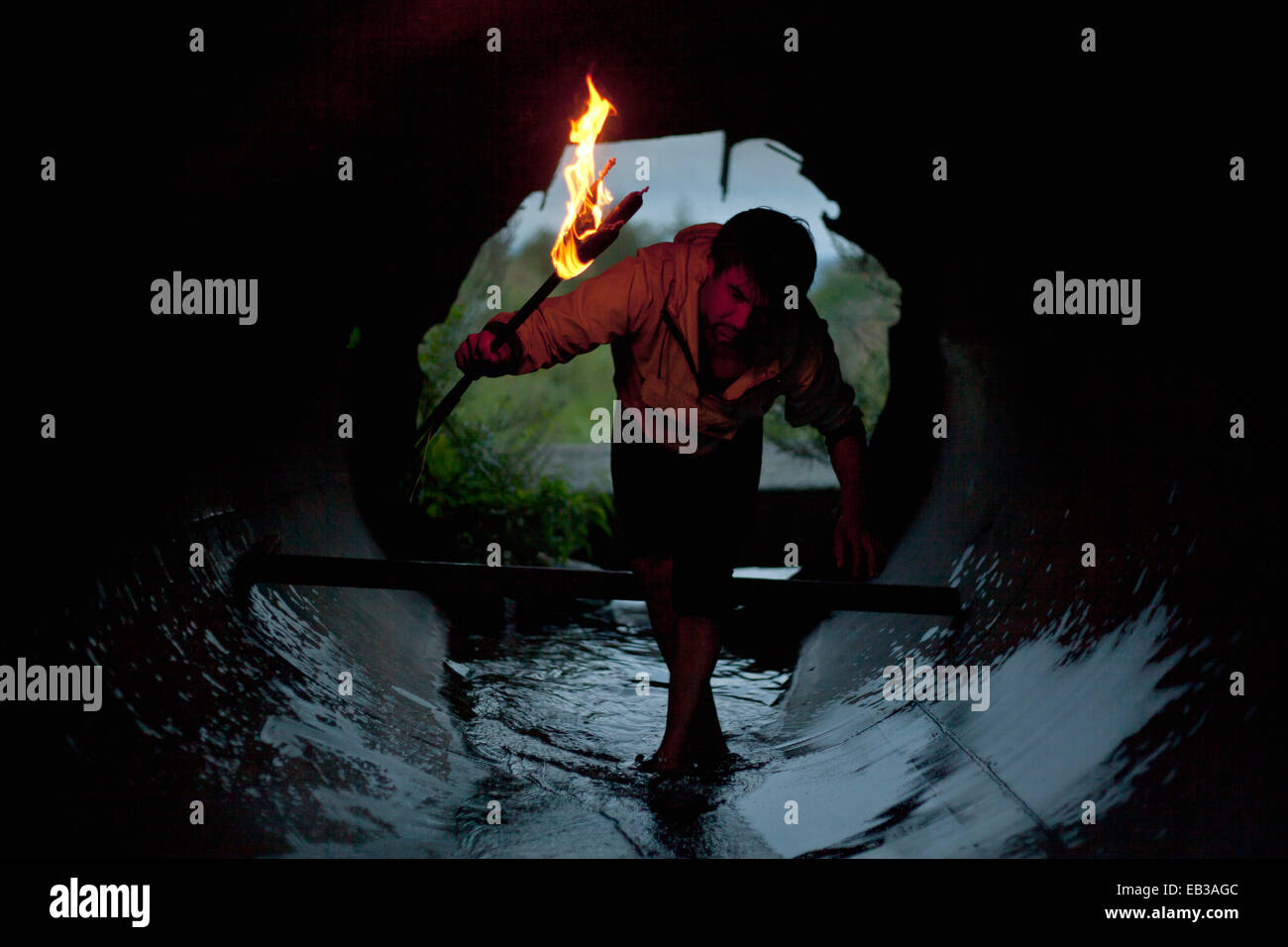Person holding torch in tunnel hi-res stock photography and images - Alamy