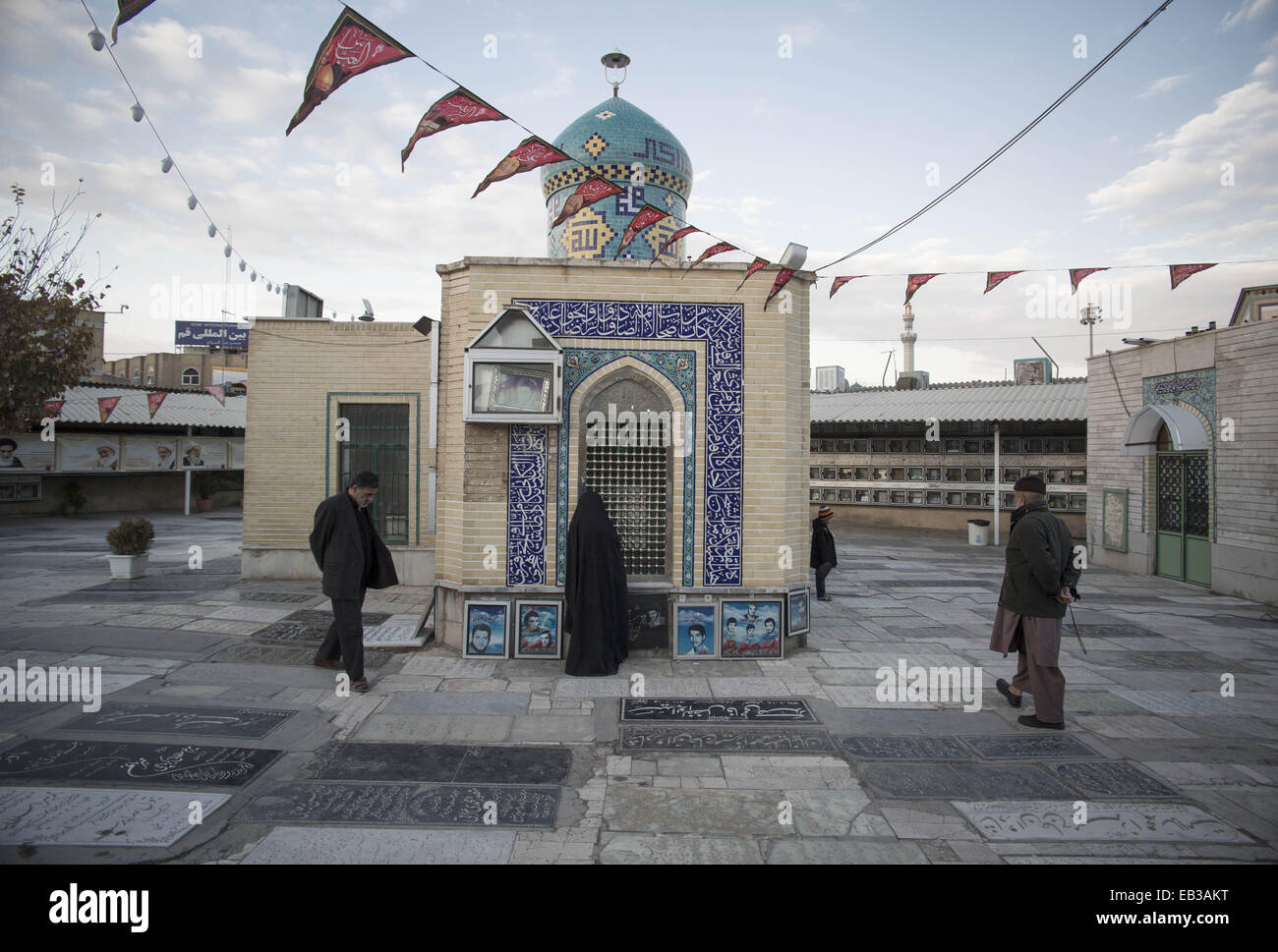Qom, Iran. 24th Nov, 2014. November 24, 2014 - Qom, Iran - People stand ...
