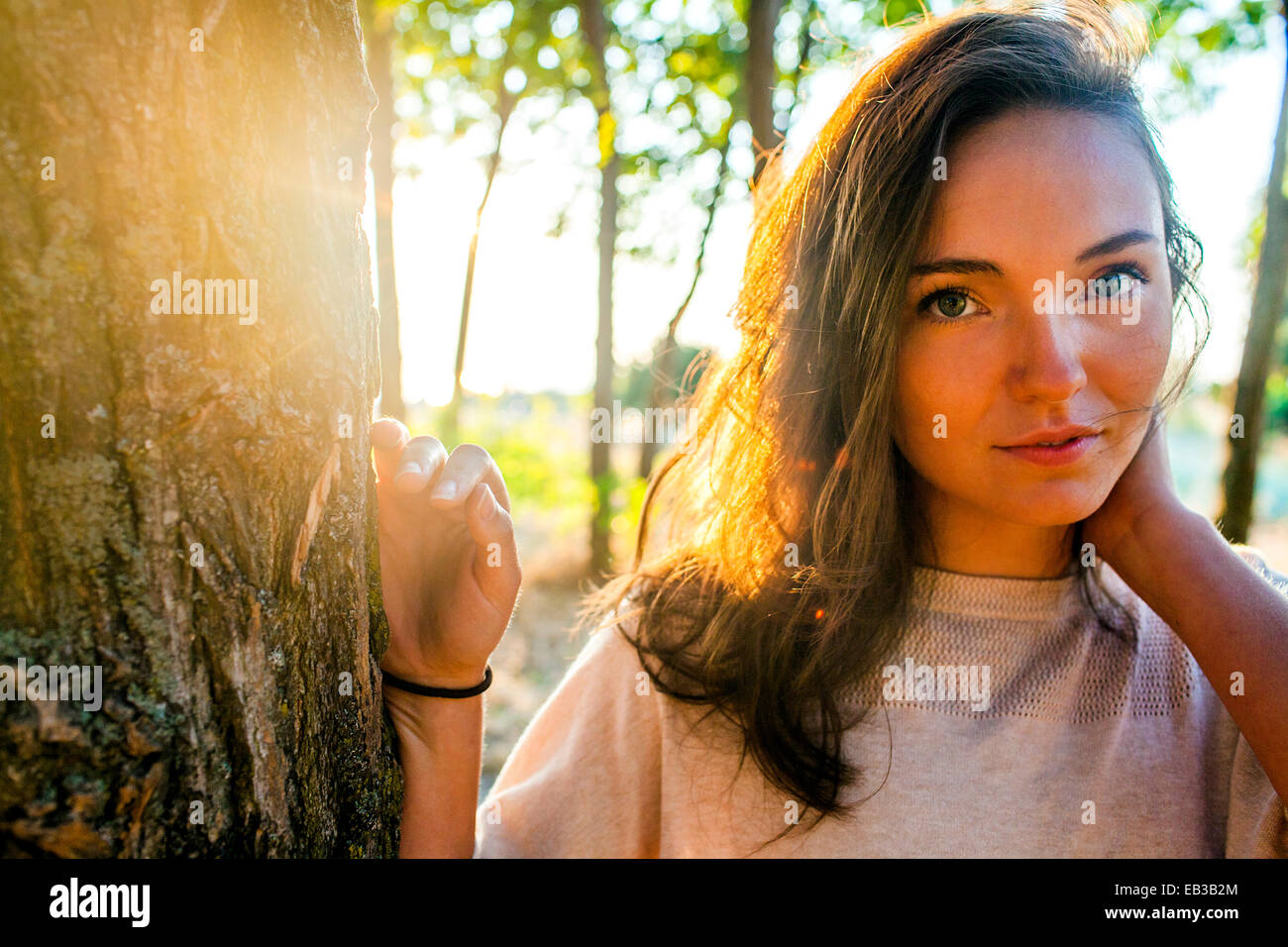 Leaning to tree hi-res stock photography and images - Alamy