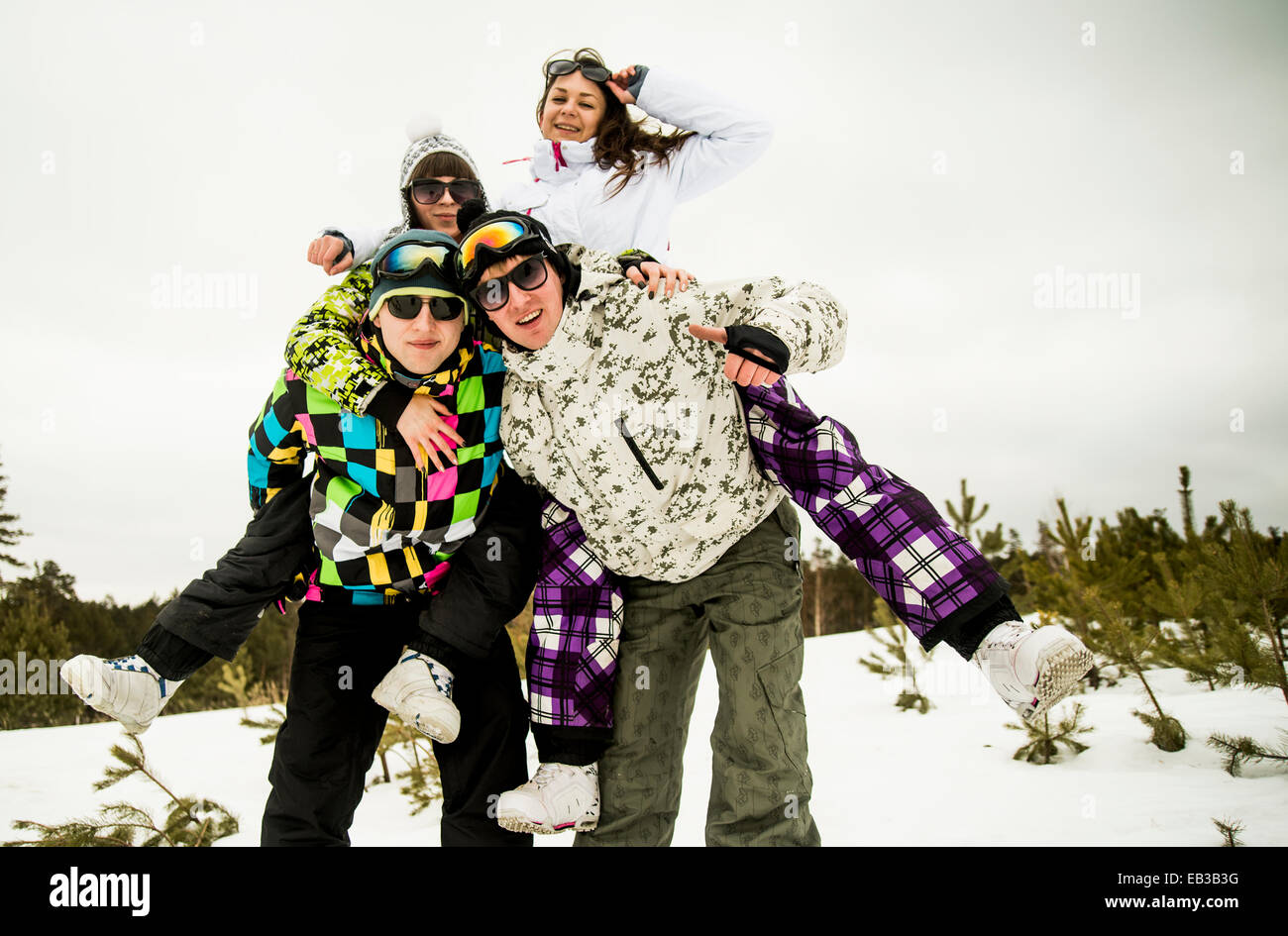 Young man playing in the snow hi-res stock photography and images - Alamy