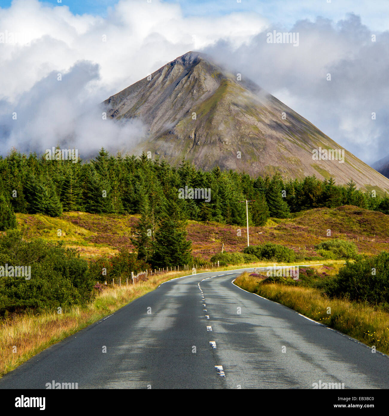 UK, Scotland, Isle of Skye Road among plain leading towards mountains ...