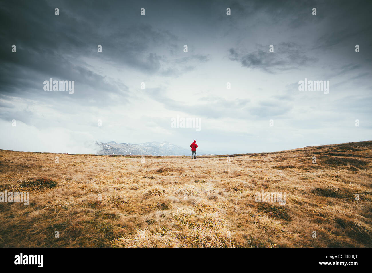 Man hiking alone Stock Photo - Alamy