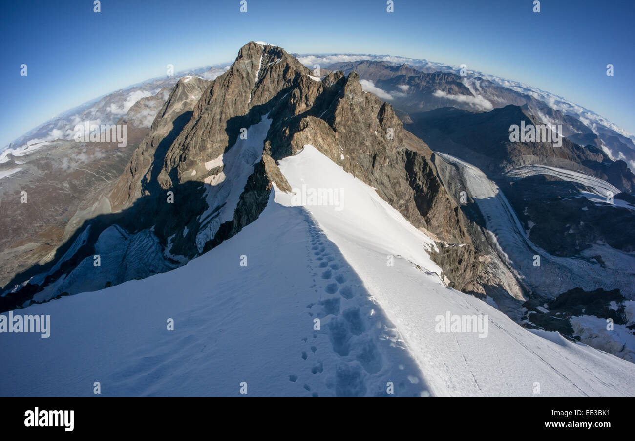 Footprints across a mountain ridge near Piz Bernina, Switzerland Stock ...