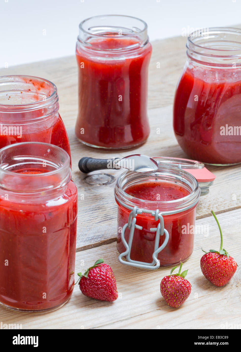 Strawberry jam in a jar on wood Stock Photo - Alamy