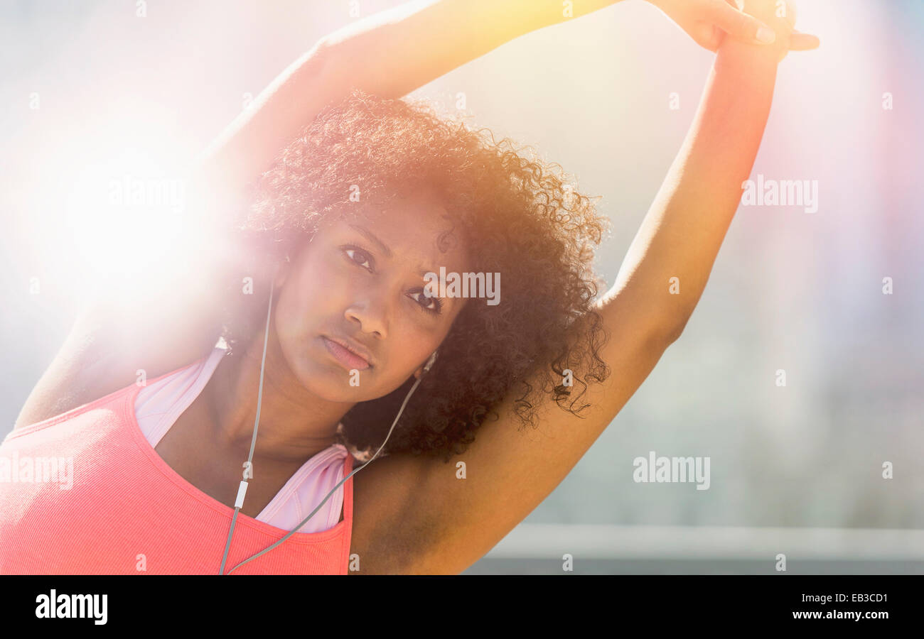 Mixed race woman stretching arms Stock Photo - Alamy