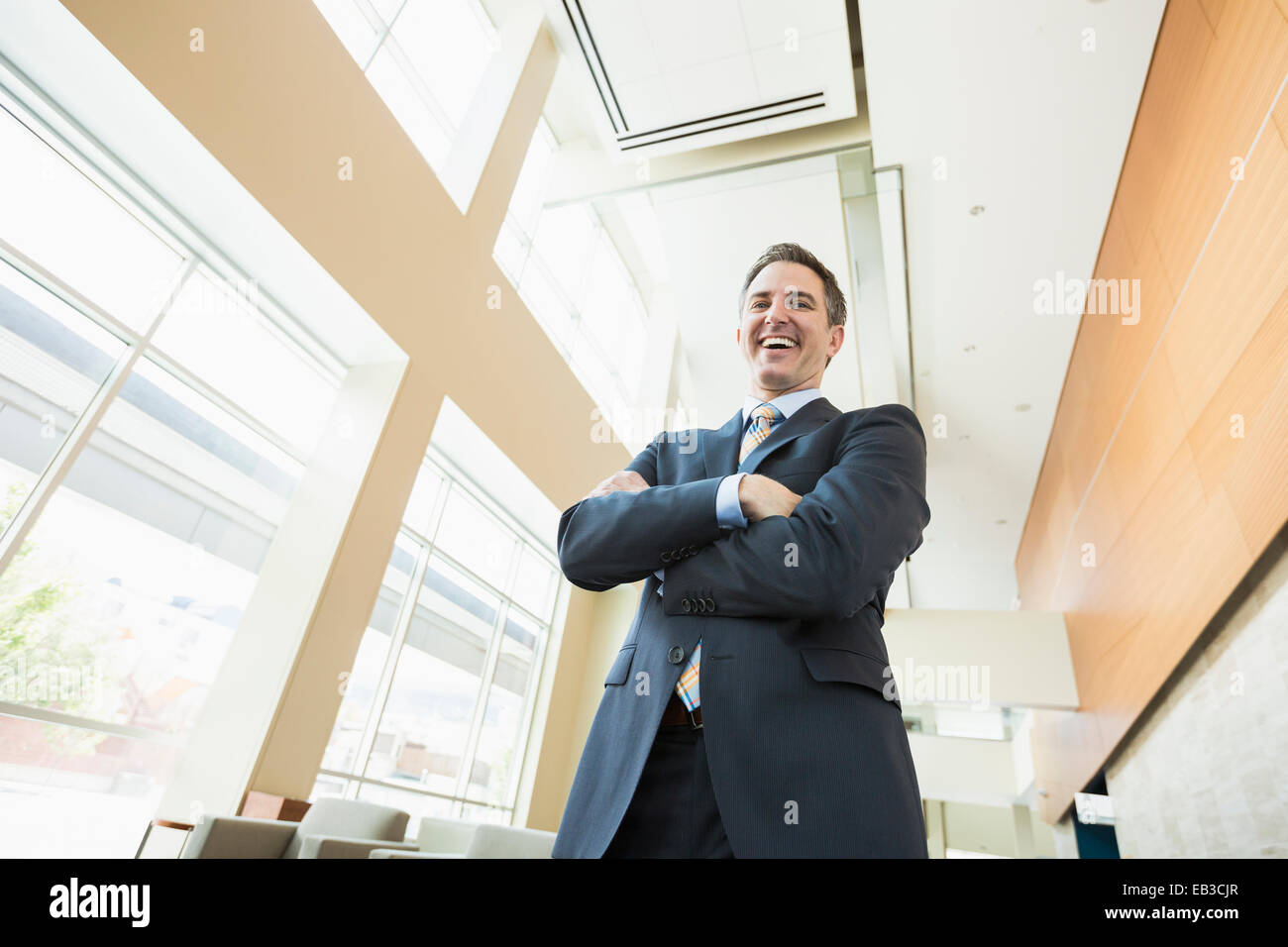 Businessman laughing arms crossed hi-res stock photography and images ...