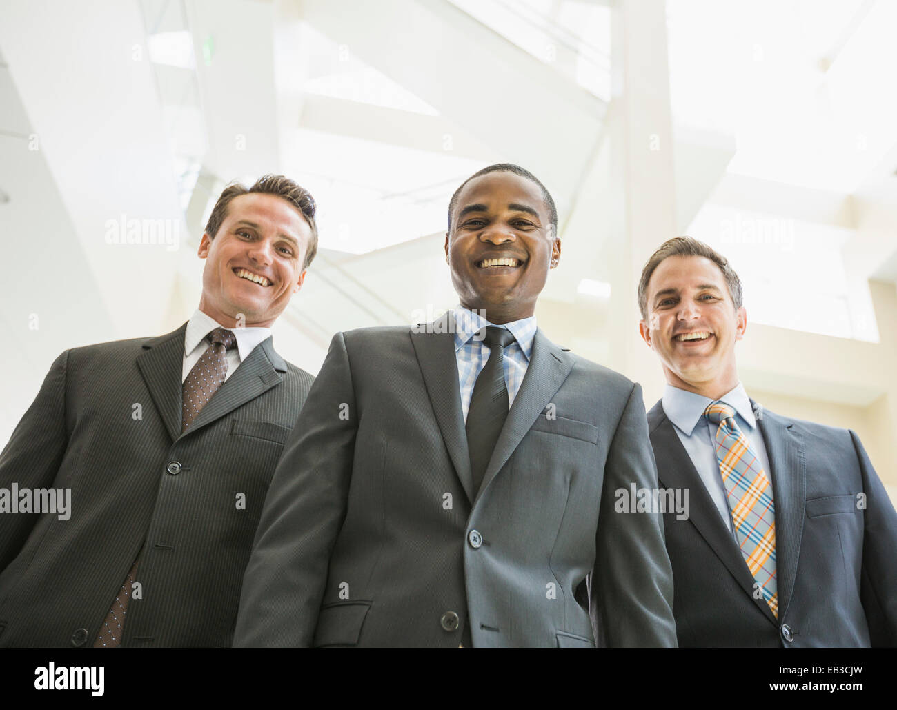 Businessmen posing in office hi-res stock photography and images - Alamy