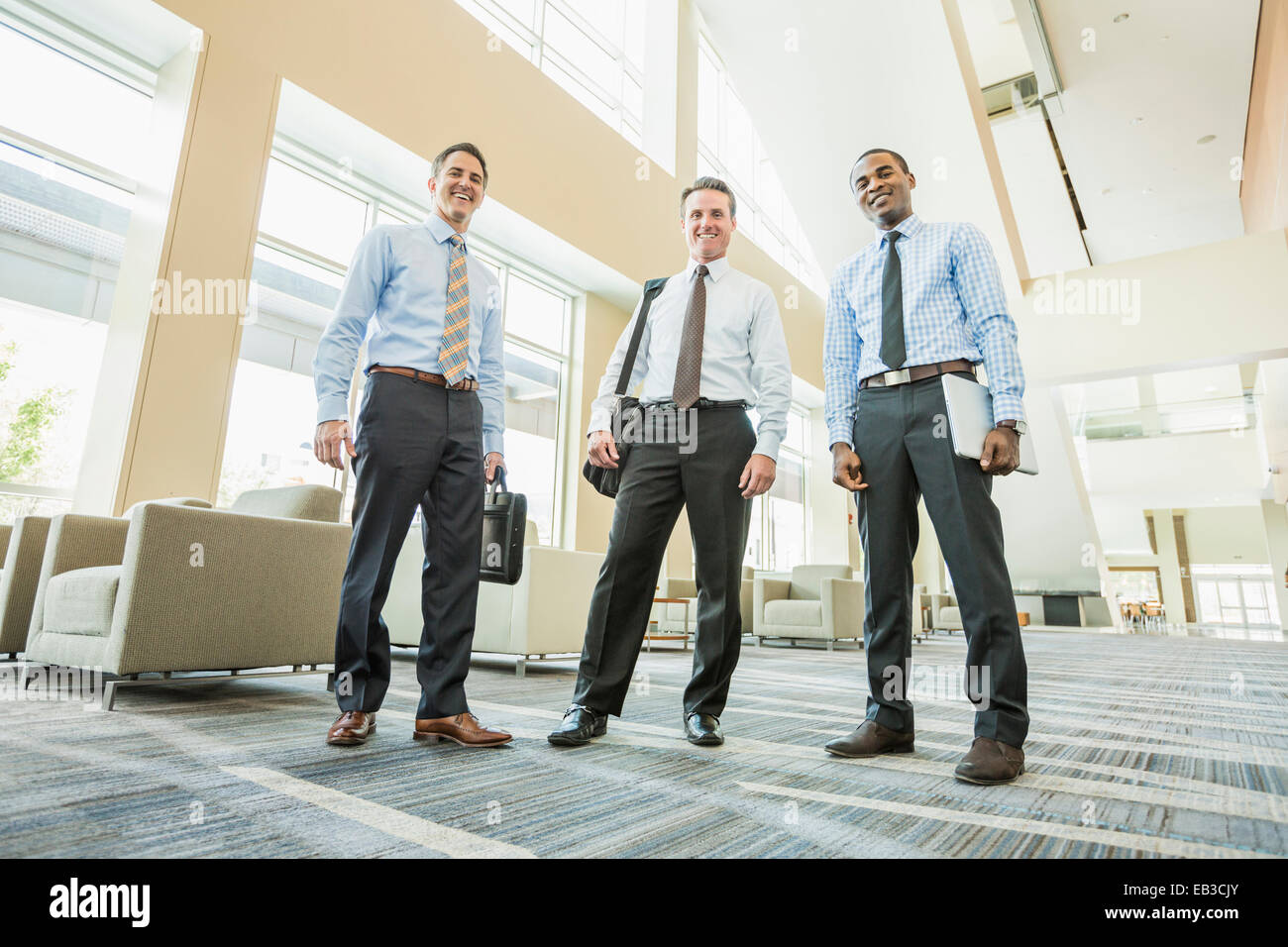 Businessmen posing in office hi-res stock photography and images - Alamy