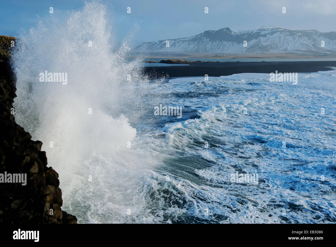 Waves splashing on rocky cliffs on beach Stock Photo - Alamy