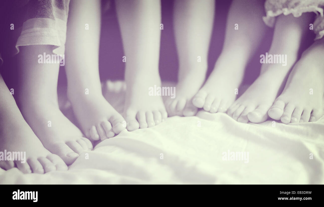 Close-up of four children's feet Stock Photo - Alamy