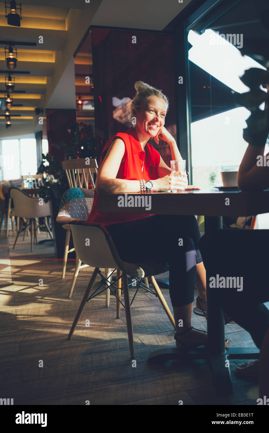Women relaxing in cafe Stock Photo - Alamy