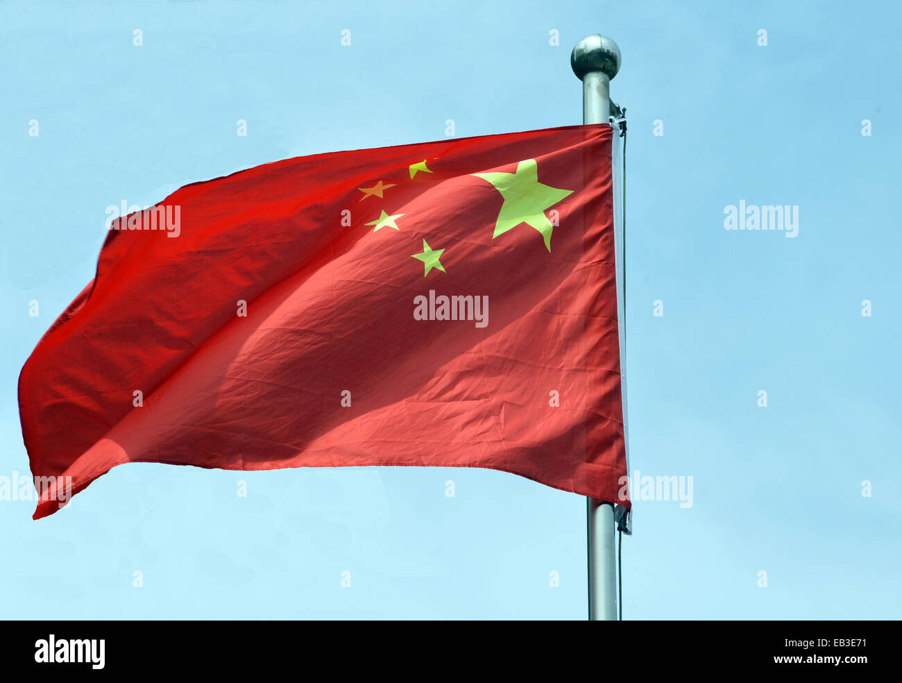 China flag in blue sky Stock Photo - Alamy
