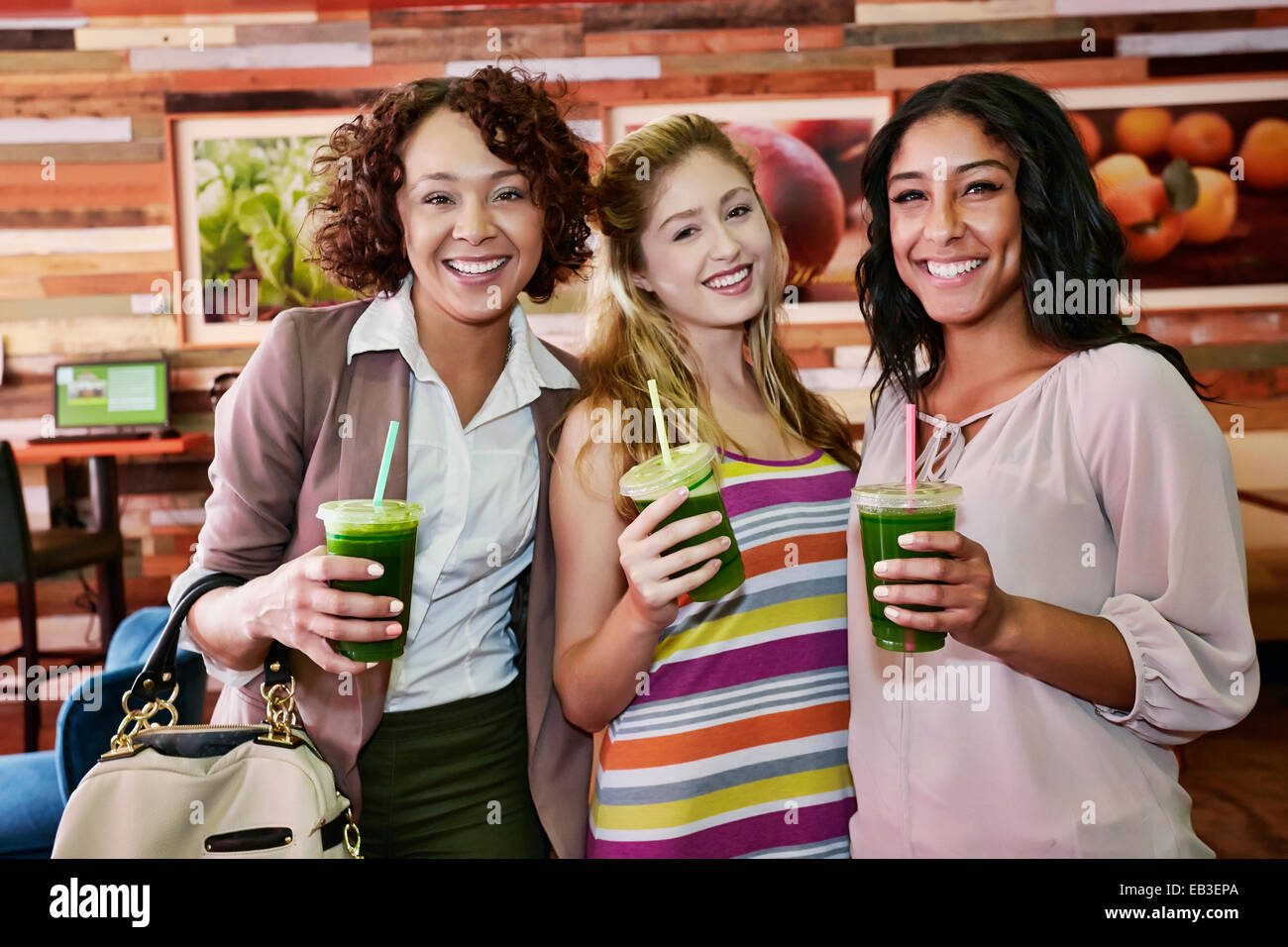 Women having juice together in cafe Stock Photo - Alamy