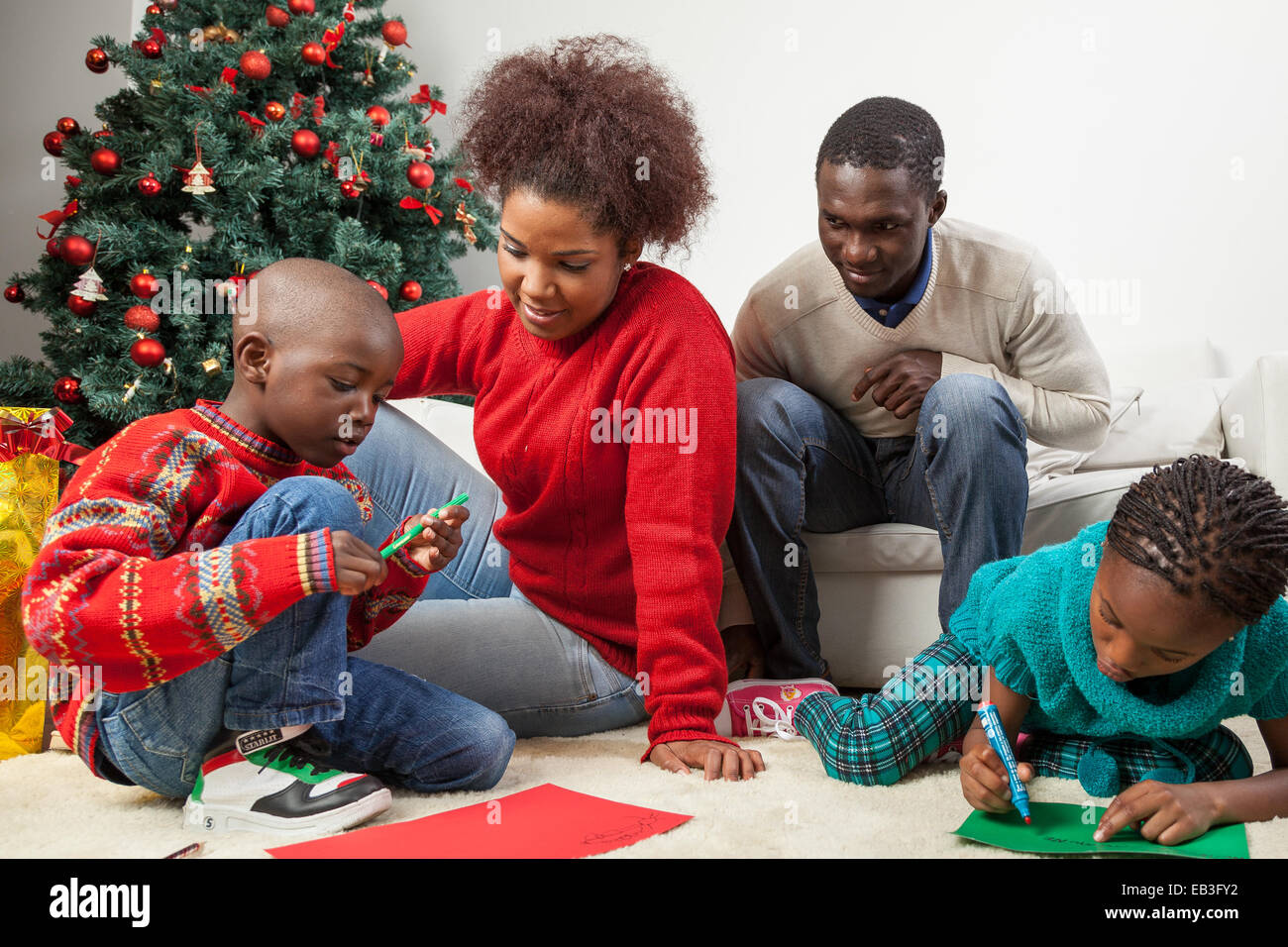 Family together writing the letter to santa Stock Photo - Alamy