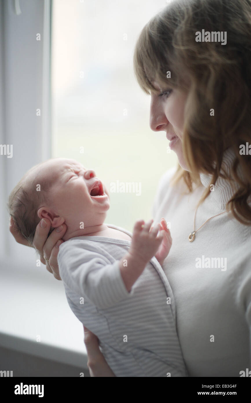 Mother Comforting Crying Child Stock Photos & Mother Comforting Crying ...