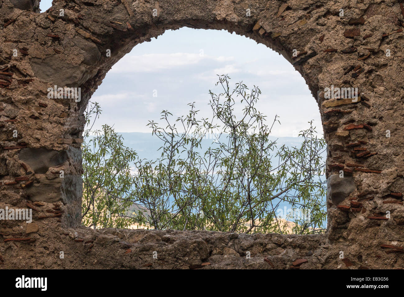 Ancient stone window that shows part of landscape Stock Photo - Alamy
