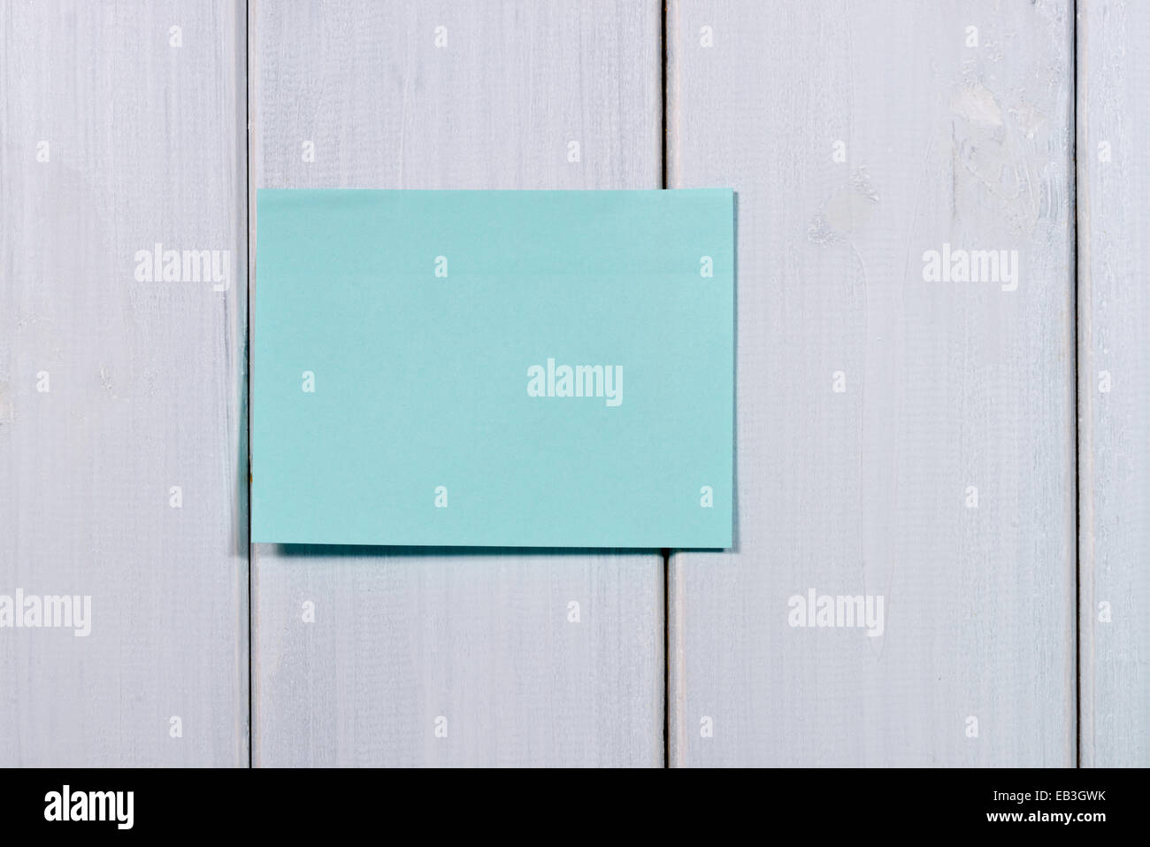 Note paper stick on wood background Stock Photo - Alamy