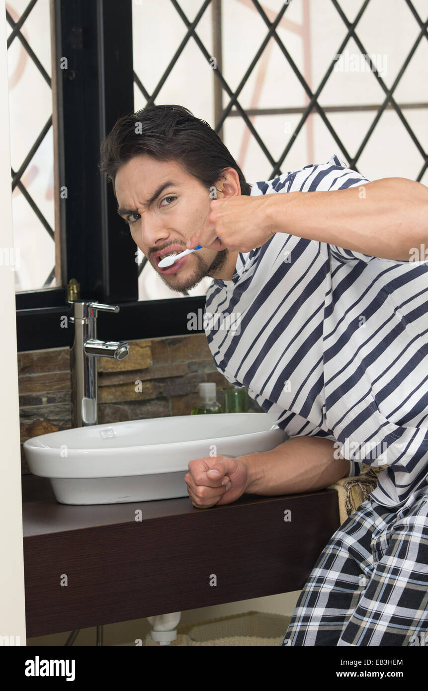 young man brushing his teeth Stock Photo - Alamy