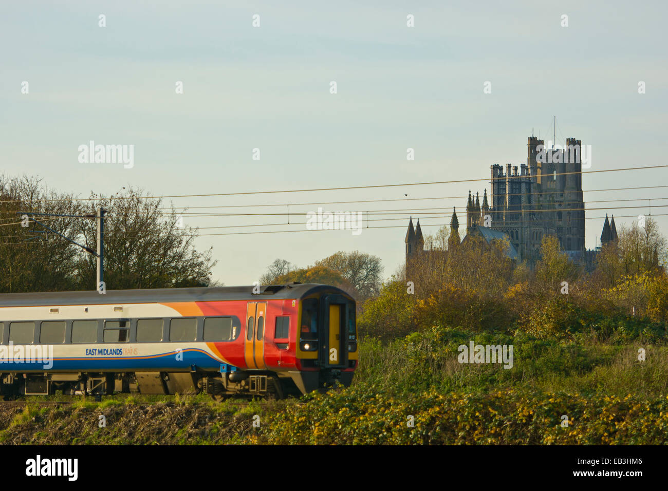 East Midlands train passenger trains passing Ely Cathedral Stock Photo ...