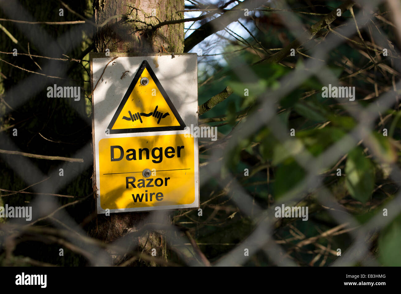 Danger razor wire sign Stock Photo - Alamy