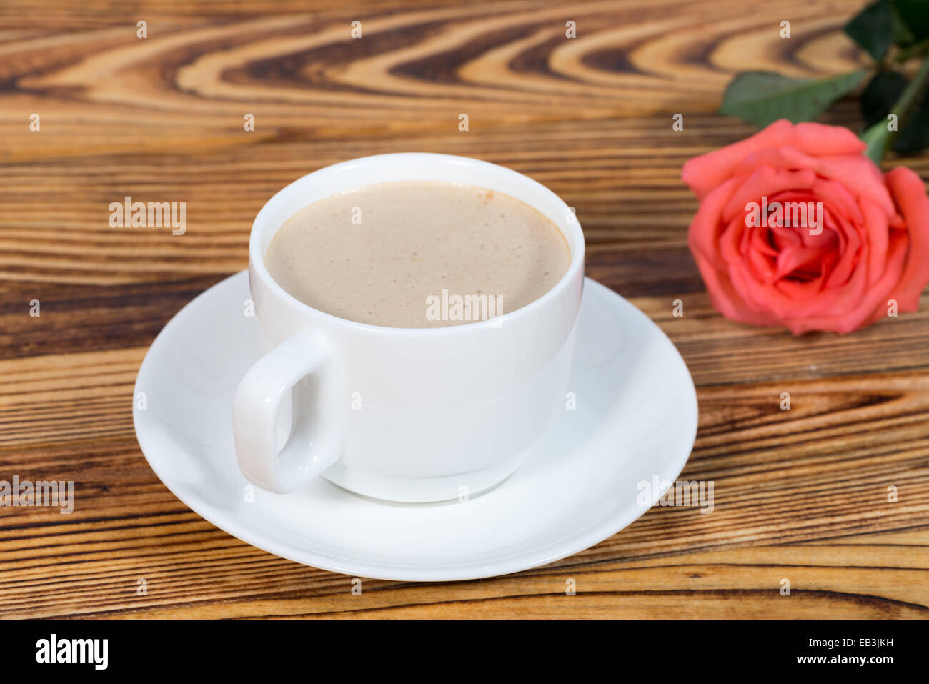 Cups of coffee and pink roses on white background Stock Photo - Alamy