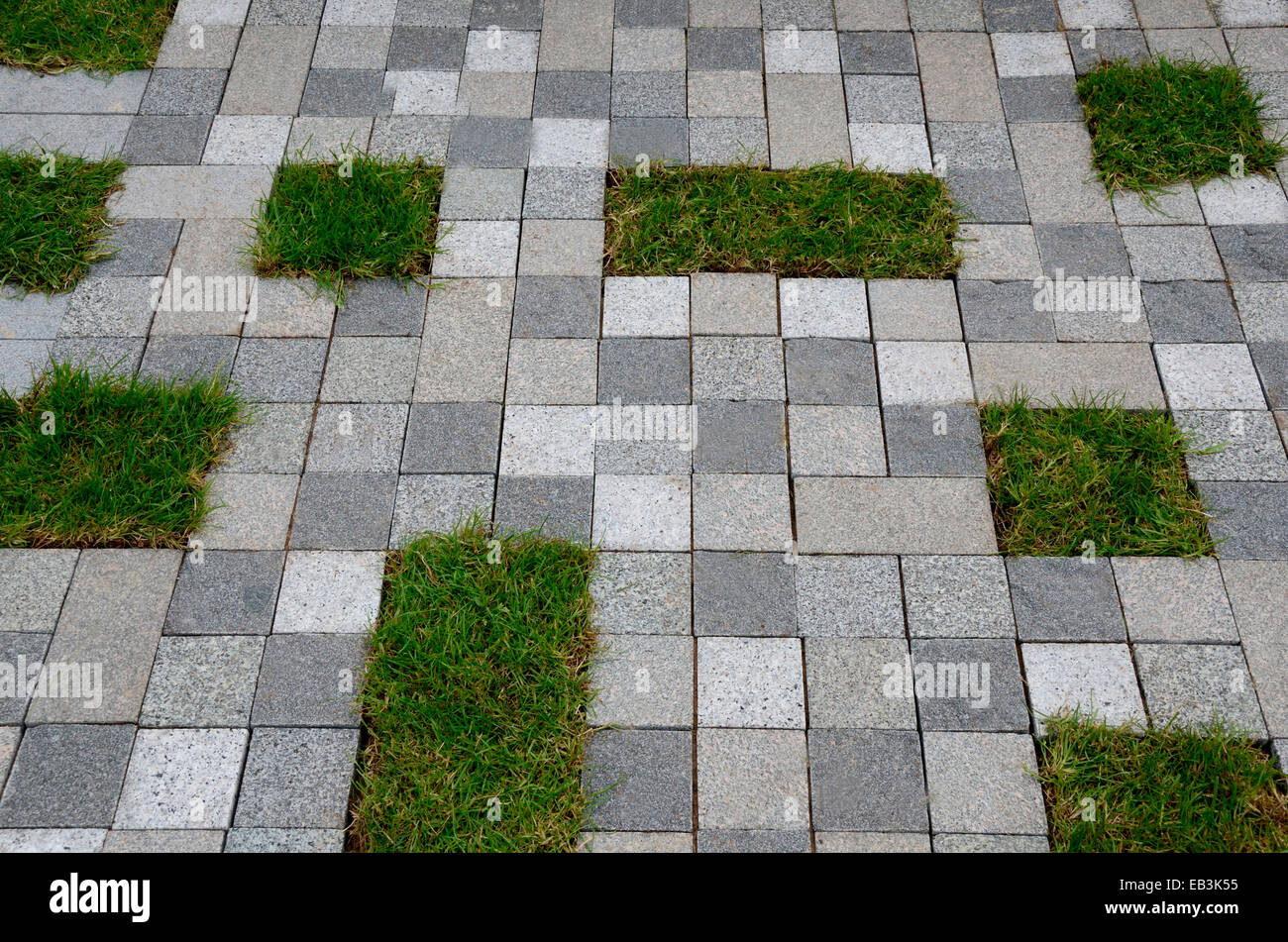 An unusual paved stone space in a public urban place with small area of ...