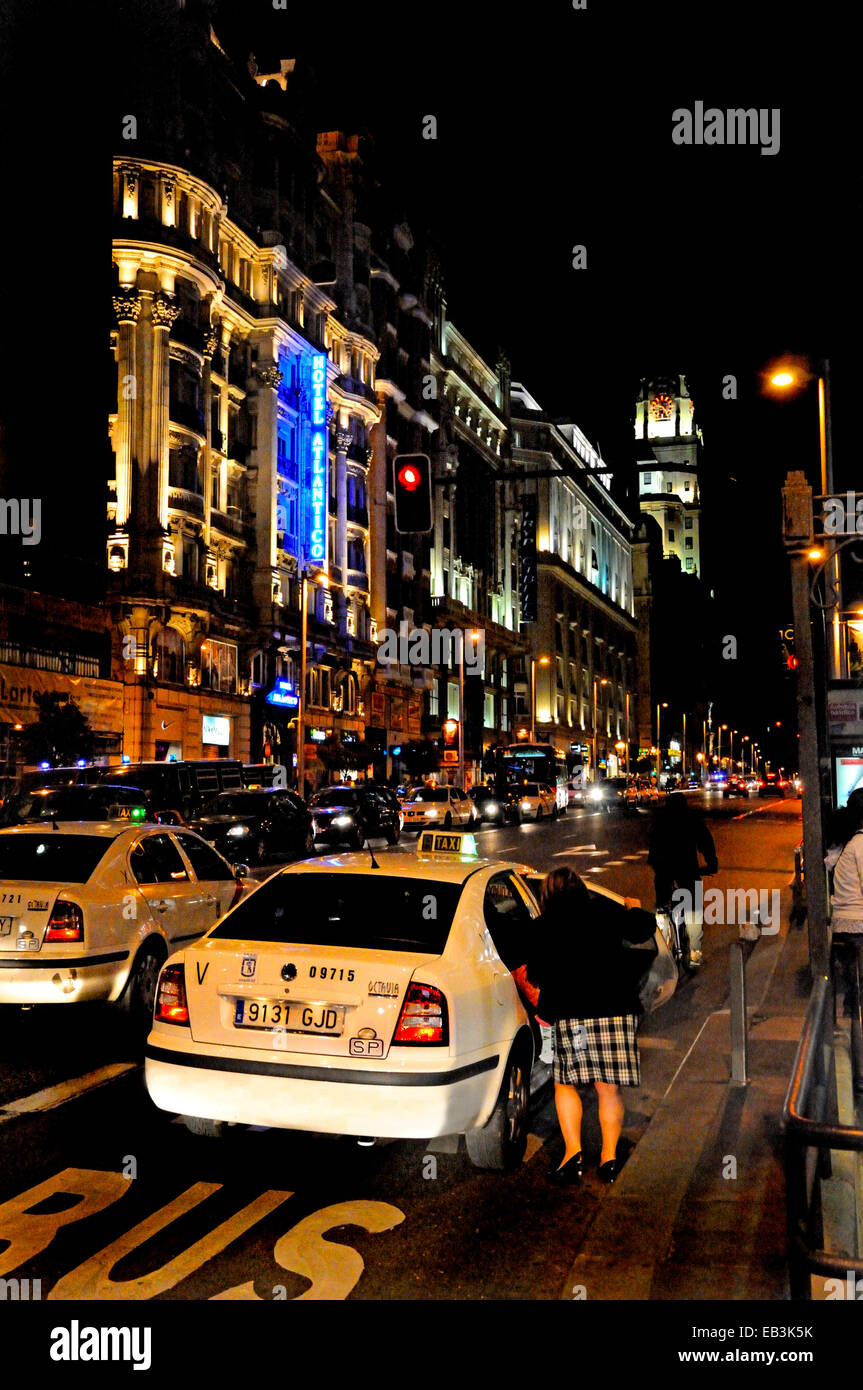 Woman getting into taxi night hi-res stock photography and images - Alamy