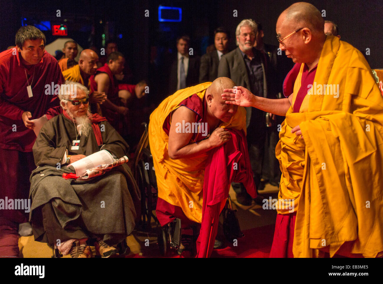 The Dalai Lama greets a senior Tibetan monk during an initiation ...