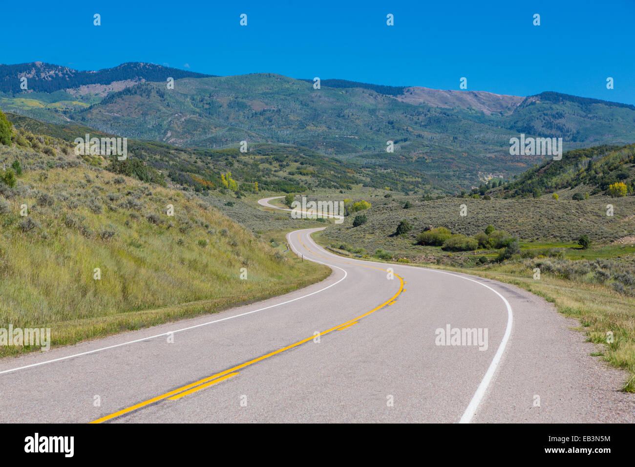 Empty curving road Route 133 in the Rocky Mountains of Colorado Stock ...