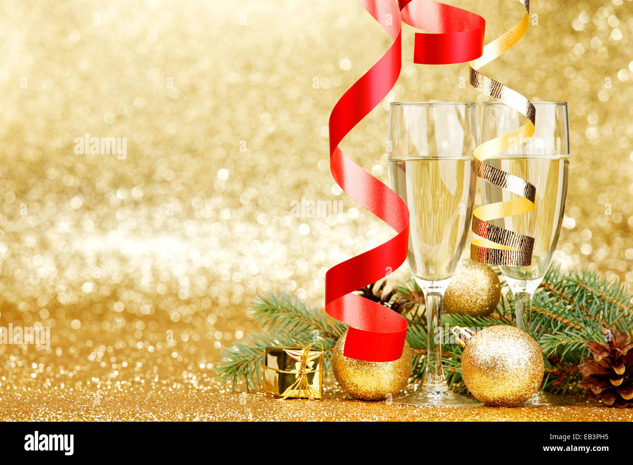 Champagne and christmas decor on glitter background Stock Photo - Alamy