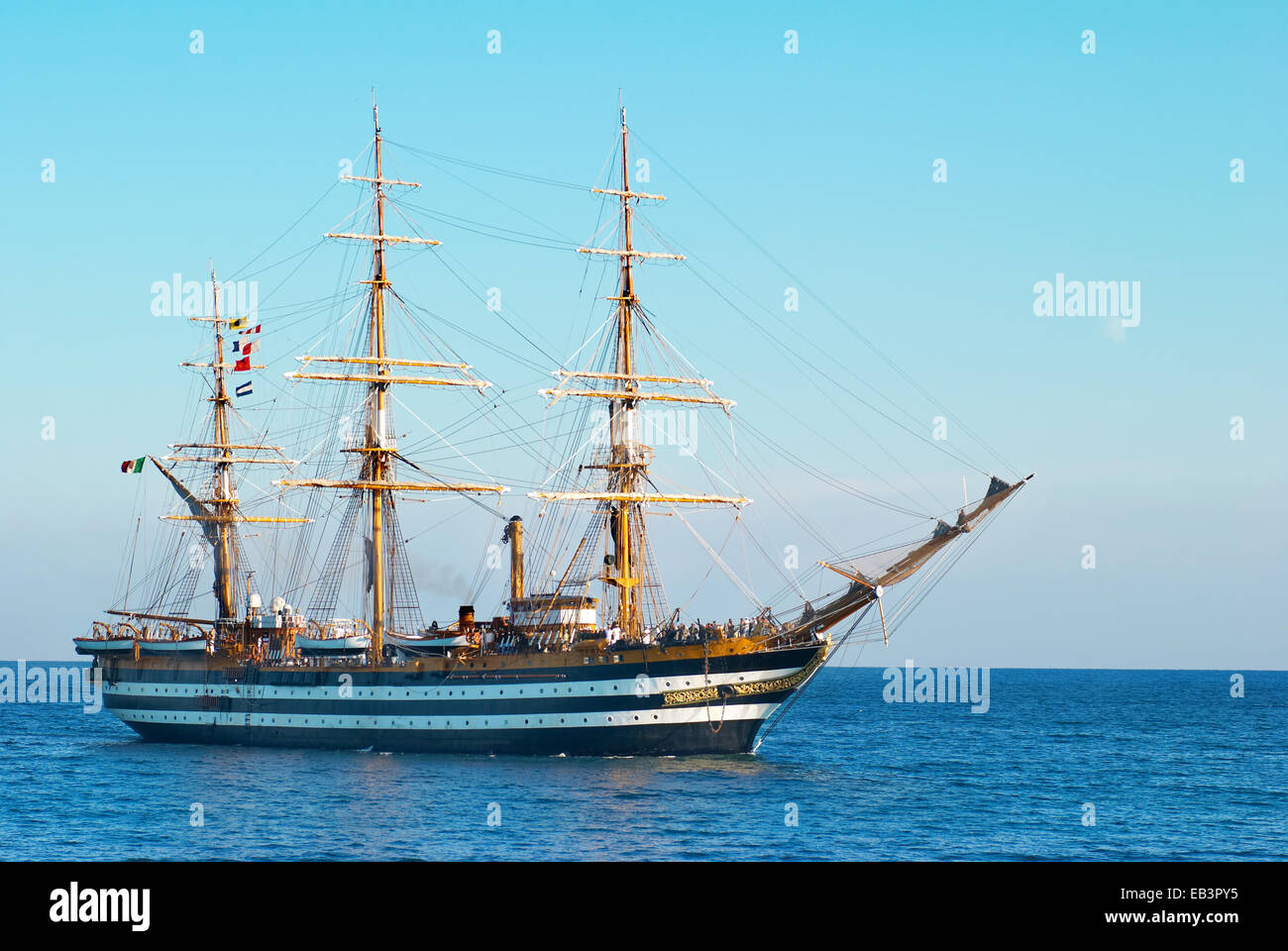 Beautiful sailing vessel in the sea comes into bay Stock Photo - Alamy